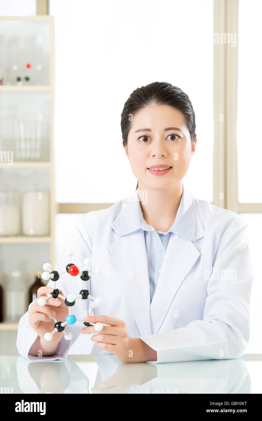 asian female scientist Examining the building blocks of life with ...
