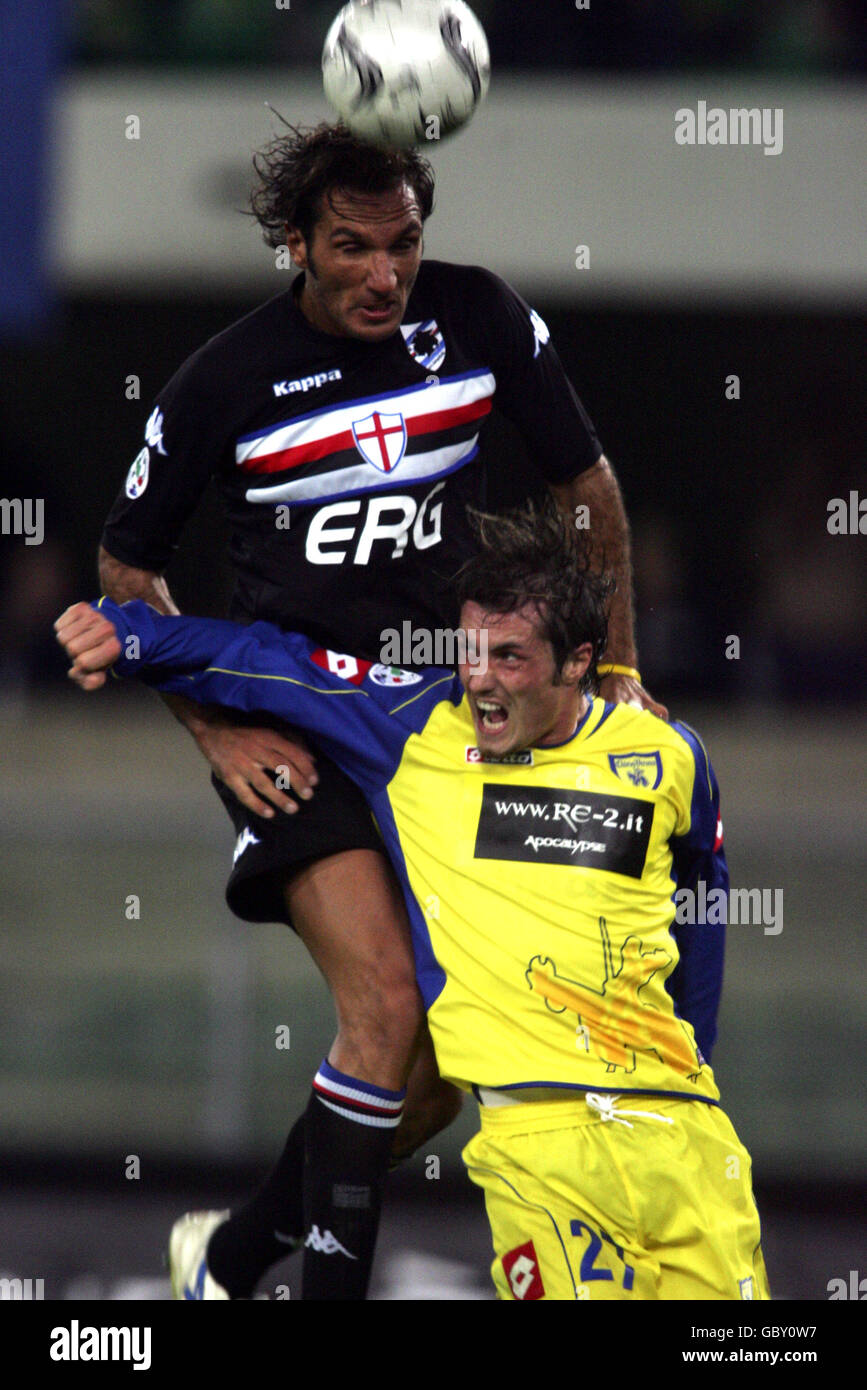 Sampdoria's Fabio Bazzani wins an aerial dual with Chievo's Fabio Moro ...