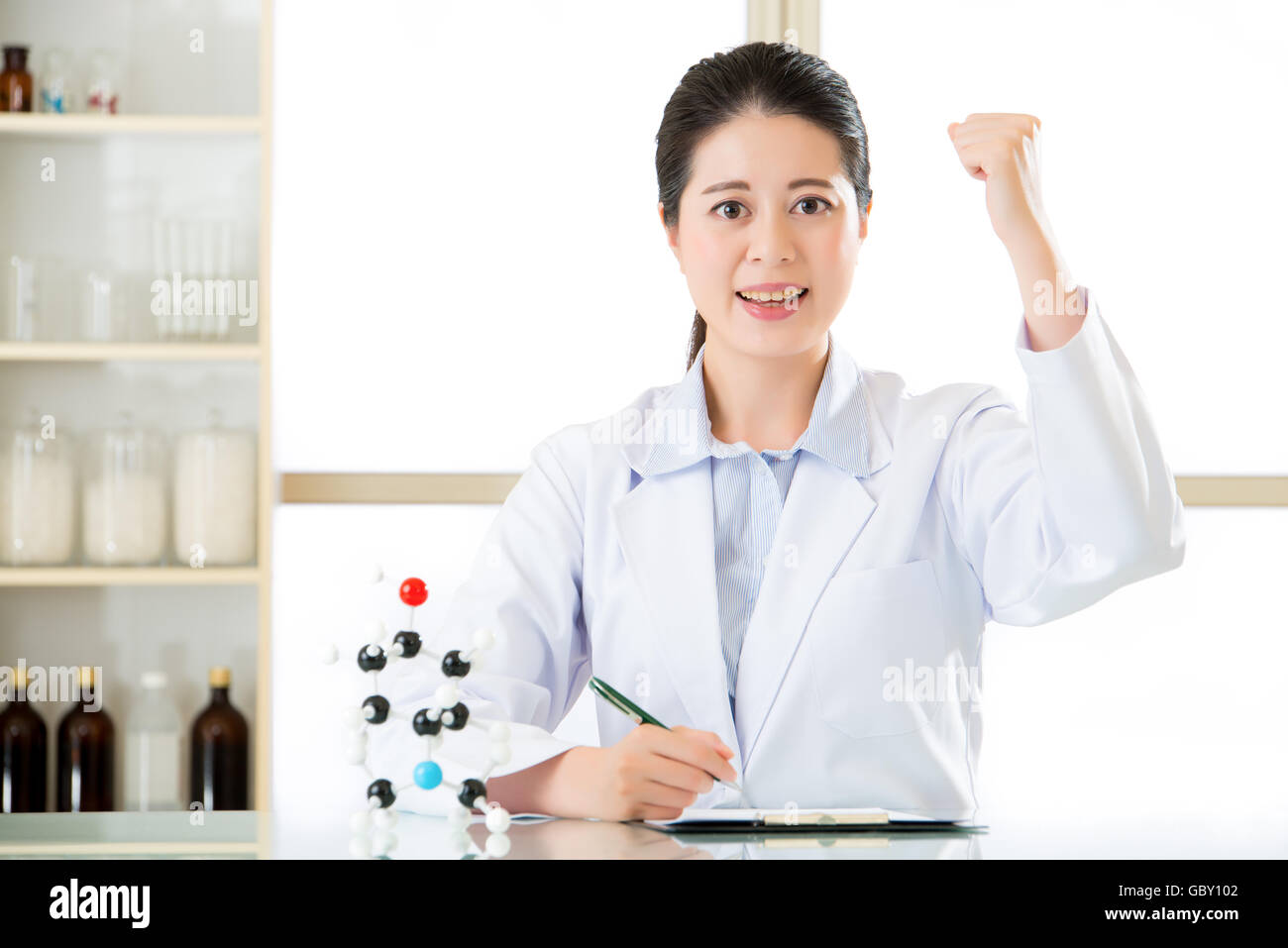 asian female scientist successful discovery Chemical formula on ...