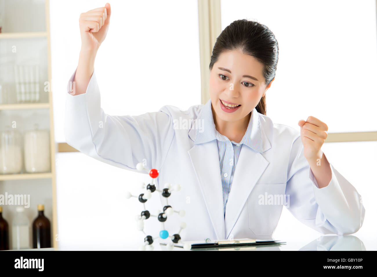 asian female scientist successful discovery Chemical formula on ...