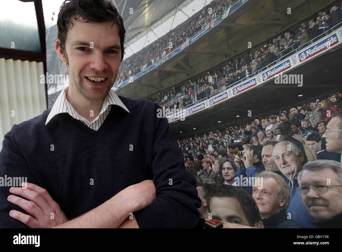 Artist Darren Baker with his painting called The Crowd which was ...