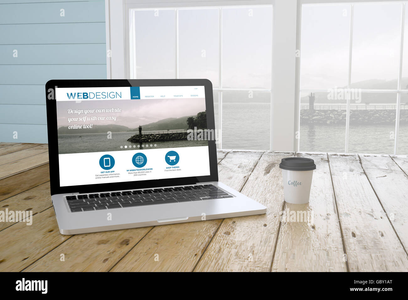 laptop with coffee showing web design website on screen near the window ...