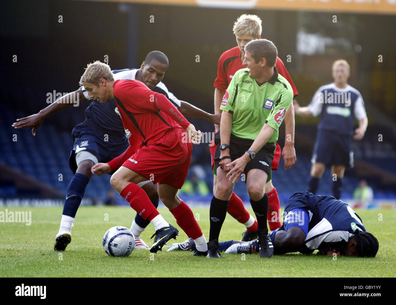 Football referee in action hi-res stock photography and images - Alamy
