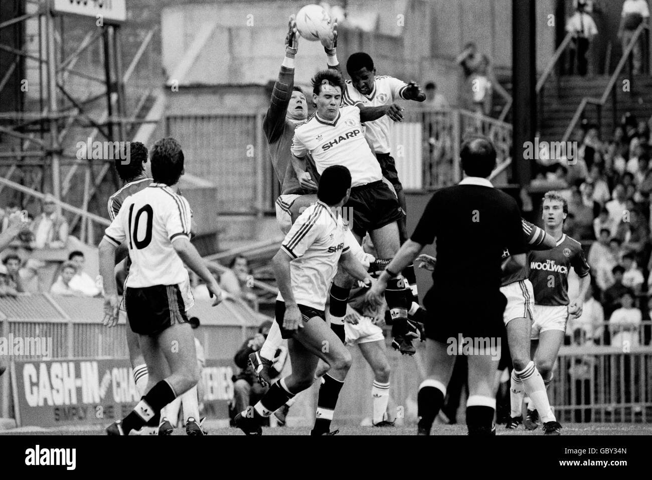 Charlton Athletic goalkeeper Bob Bolder (third l) catches the ball ...