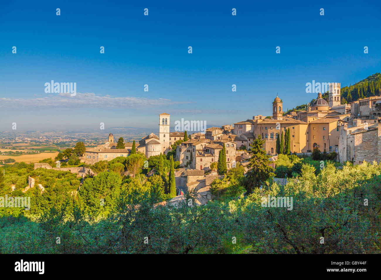 Panoramic view of the historic town of Assisi in beautiful golden ...