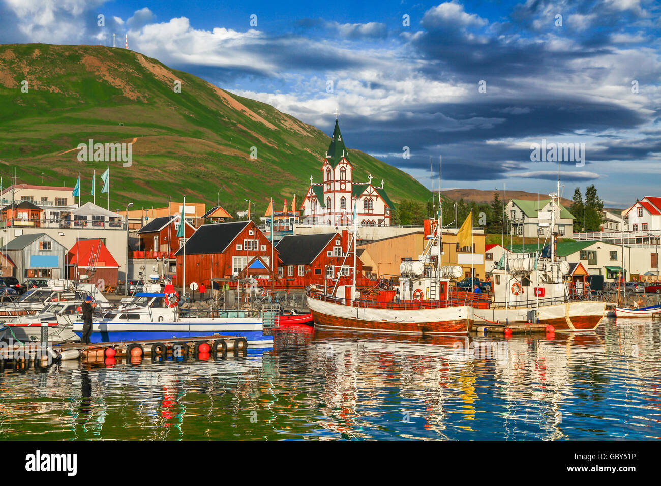 Beautiful view of the historic town of Husavik in golden evening light ...
