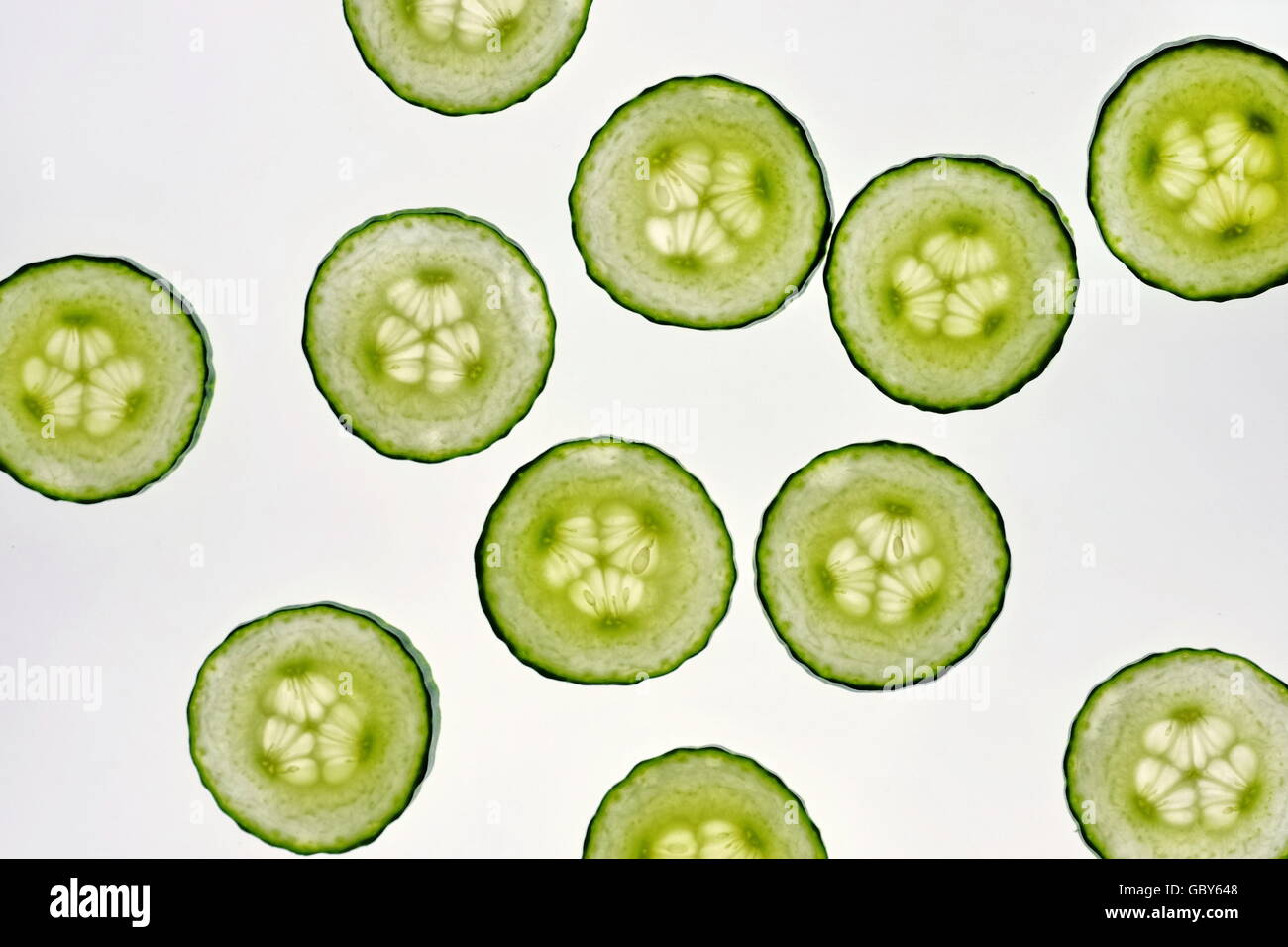 Fresh sliced cucumbers on white background Stock Photo - Alamy