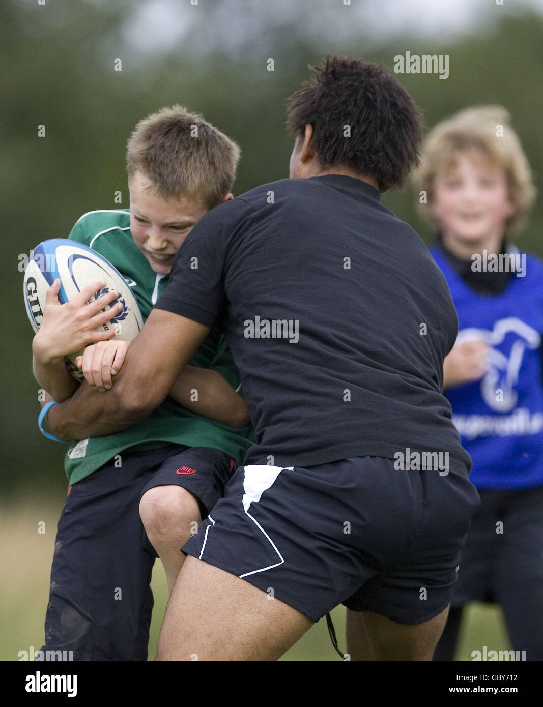 Glasgow Warriors players help coach children during the Scottish Rugby ...