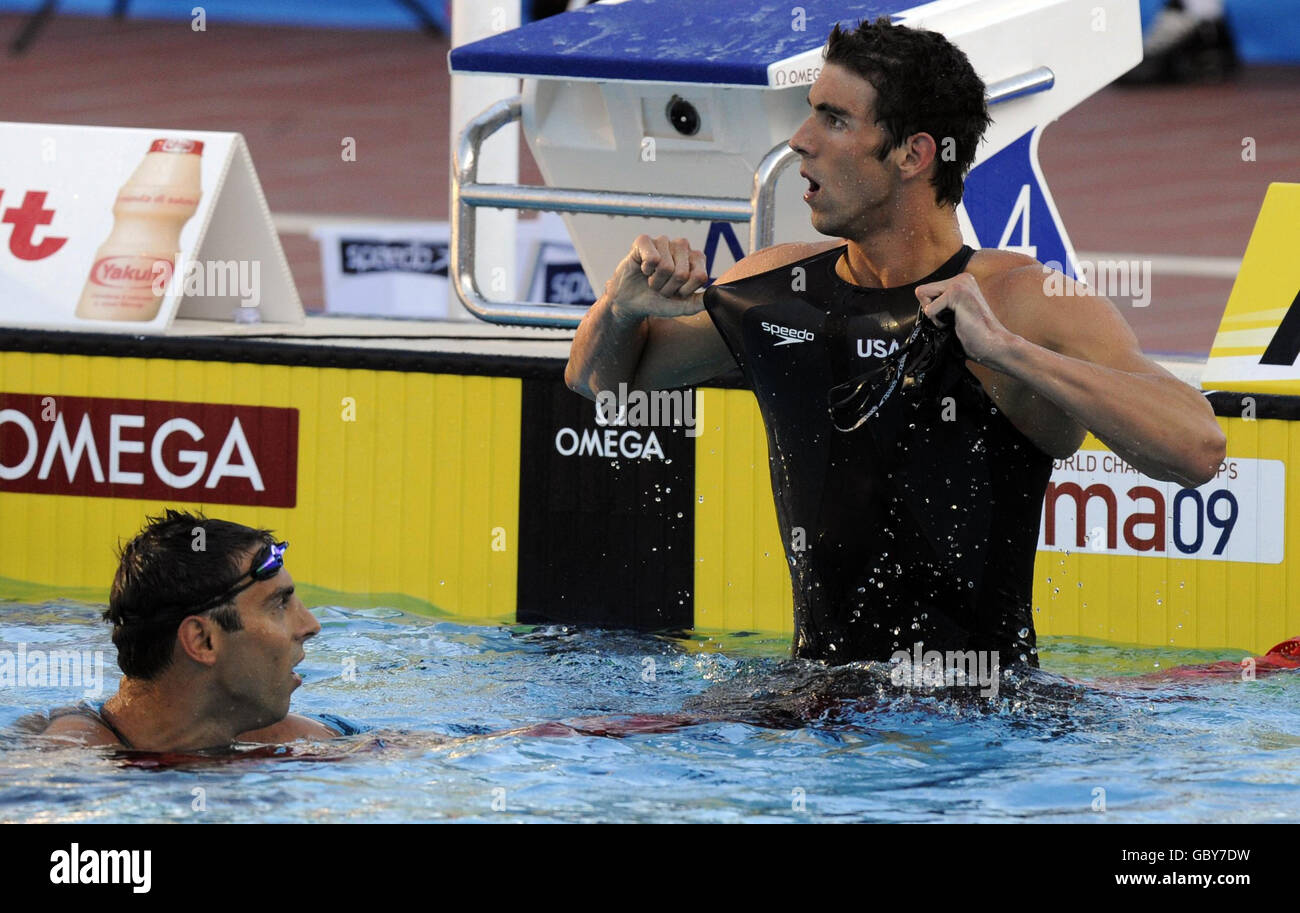 USA's Michael Phelps (right) after winning the Men's 100m Butterfly ...