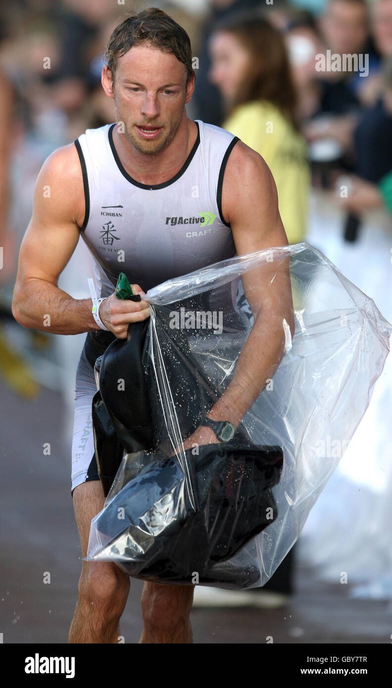 Formula One driver Jenson Button makes the transition between swimming ...