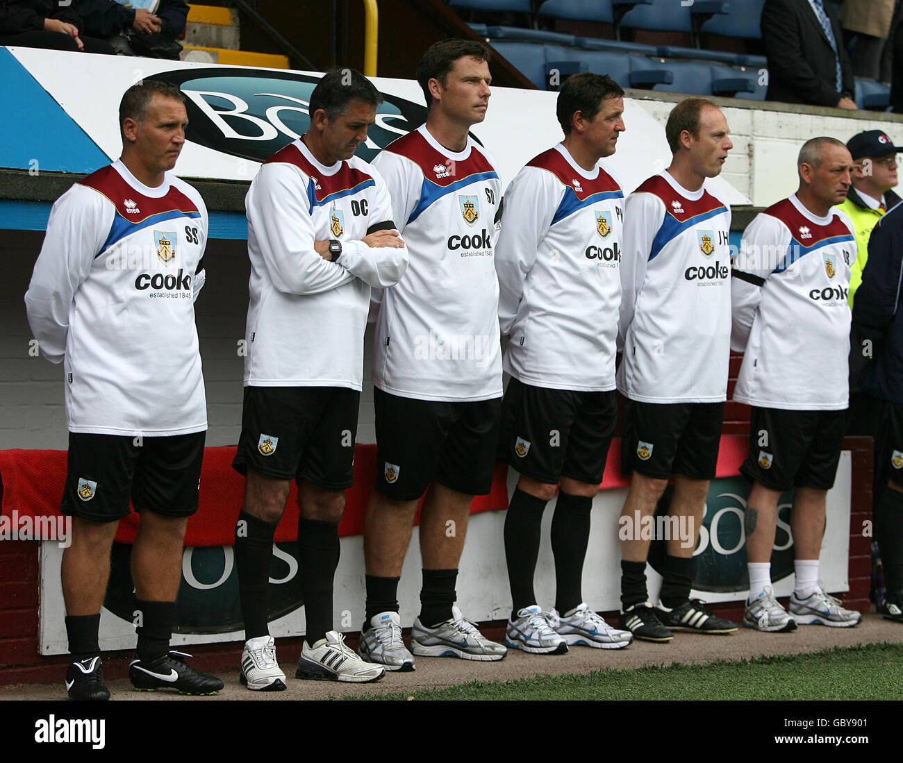 Burnley manager Owen Coyle (2nd left) stands alongside his back room ...