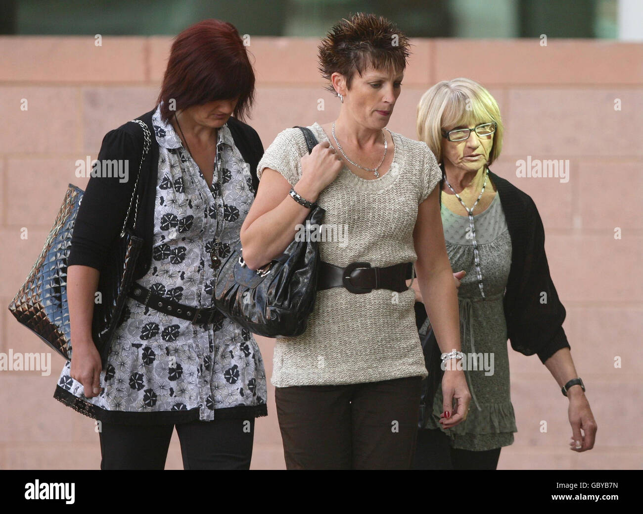 Maureen Dowling (right) with her two daughters leaving Preston Crown ...