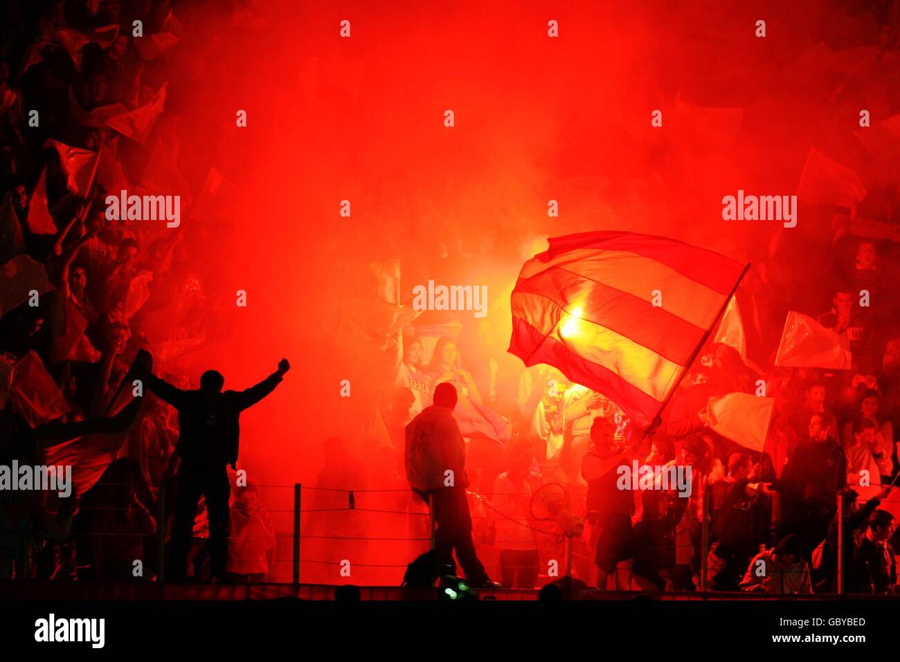 Monaco fans let off flares during the game against liverpool hi-res ...