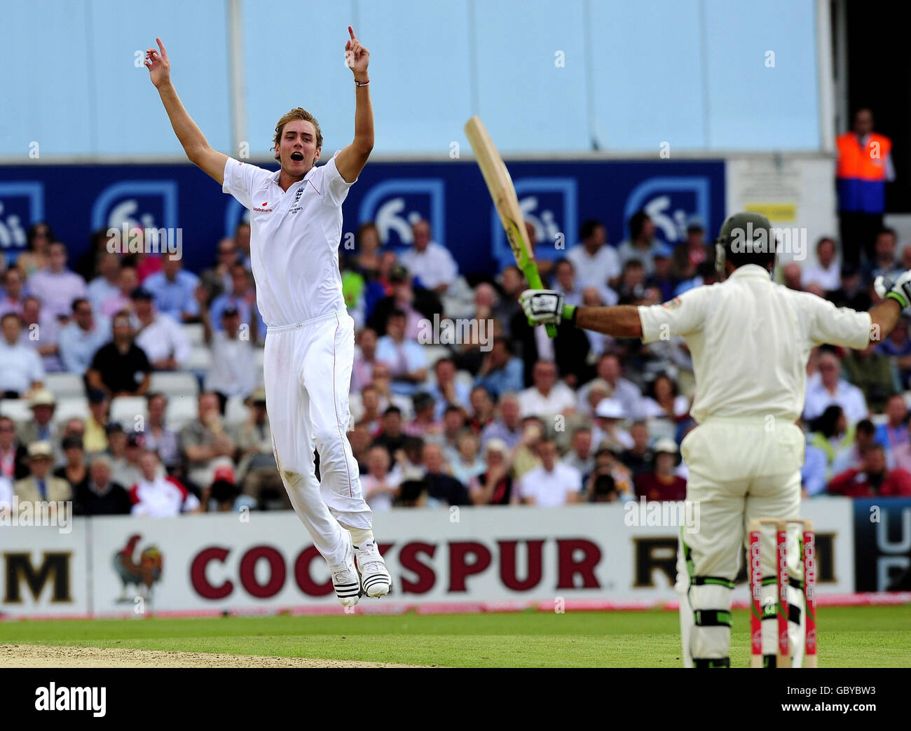 Cricket celebrating jumping arms raised hi-res stock photography and ...