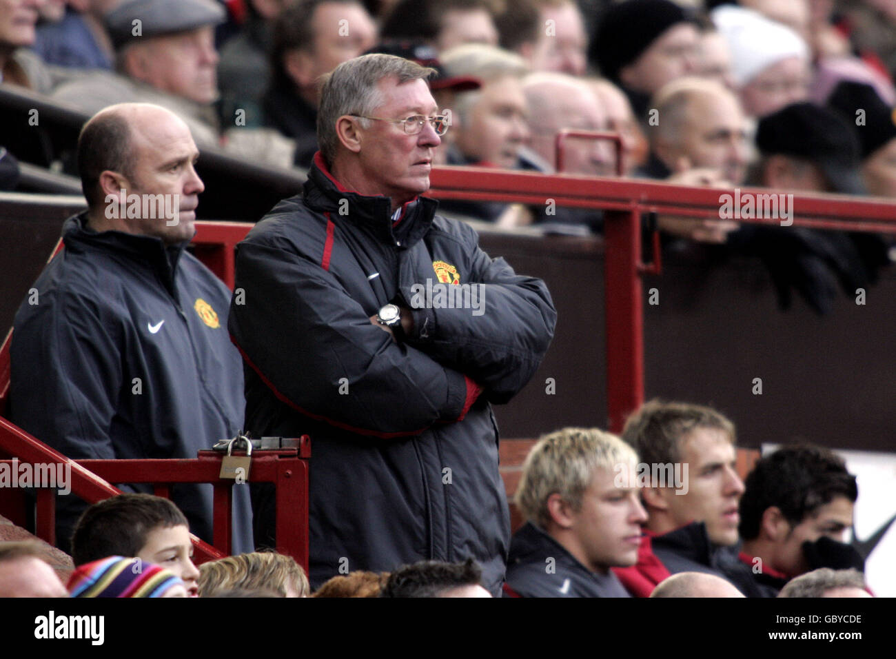 Manchester United manager Sir Alex Ferguson watches the action ...