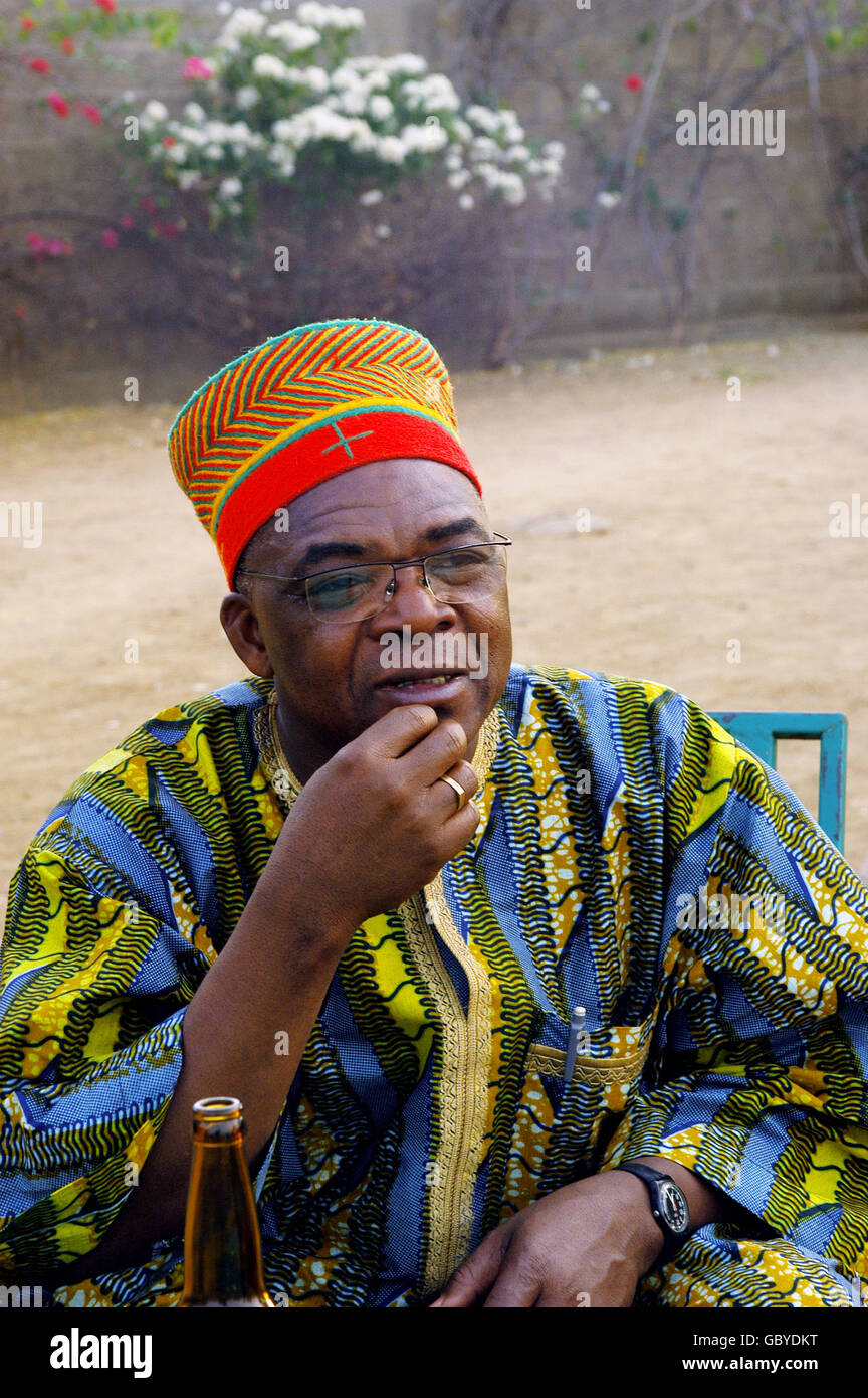 Portrait of a village chief in conversation with one of his friends ...