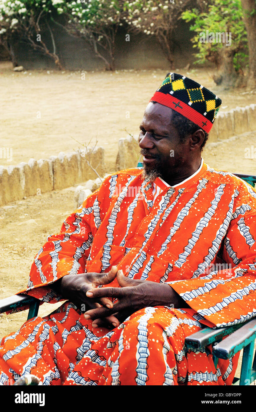 Portrait of a village chief in conversation with one of his friends ...