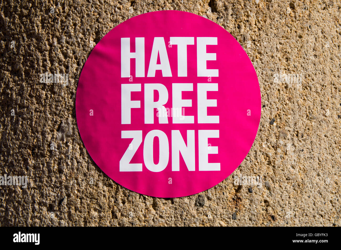 HATE FREE ZONE sticker on sandstone column by Embassy entrance Stock ...