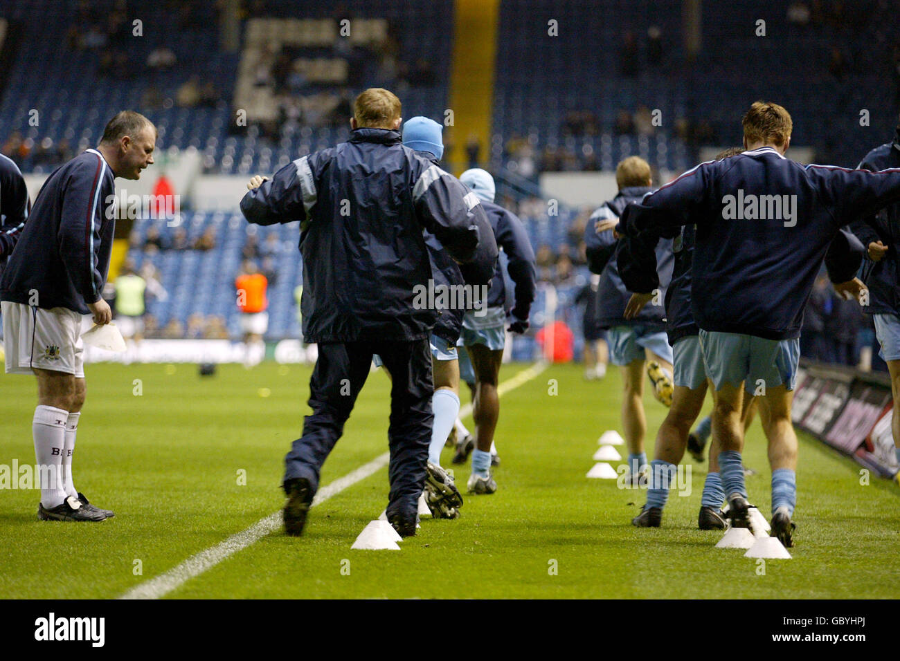 The Burnley team warm up with the assistant manager Dave Kevan Stock ...
