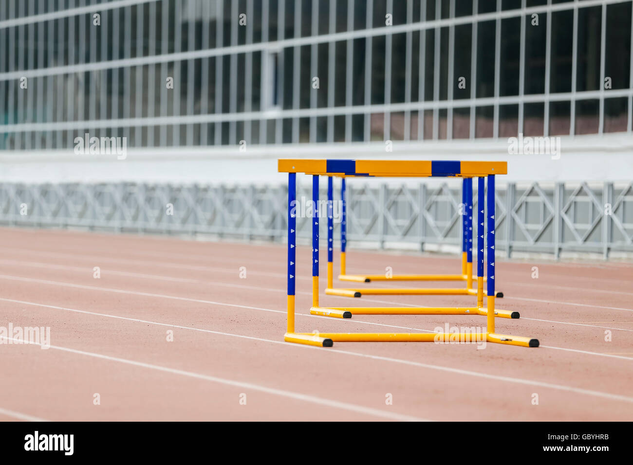 barriers at stadium for a run at 400 meter hurdles Stock Photo - Alamy