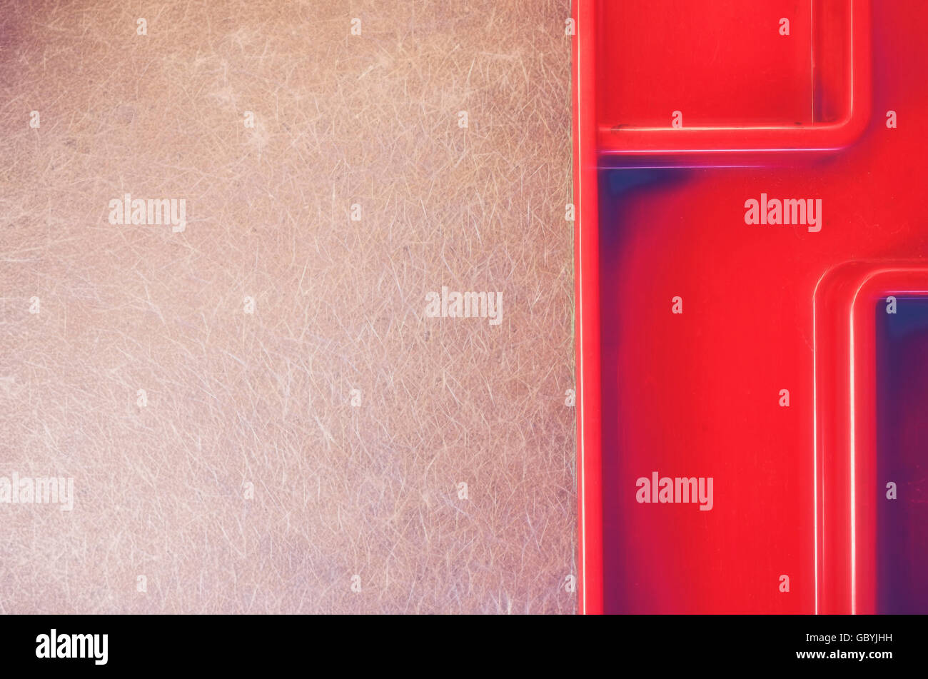 red plastic object on a stone surface - glowing colors Stock Photo - Alamy