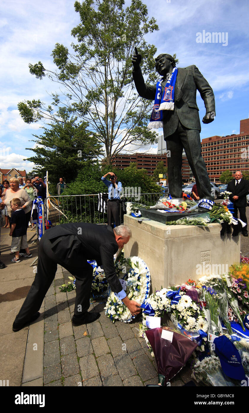 Ipswich Town Chief Executive Simon Clegg leaves a wreath of flowers at ...