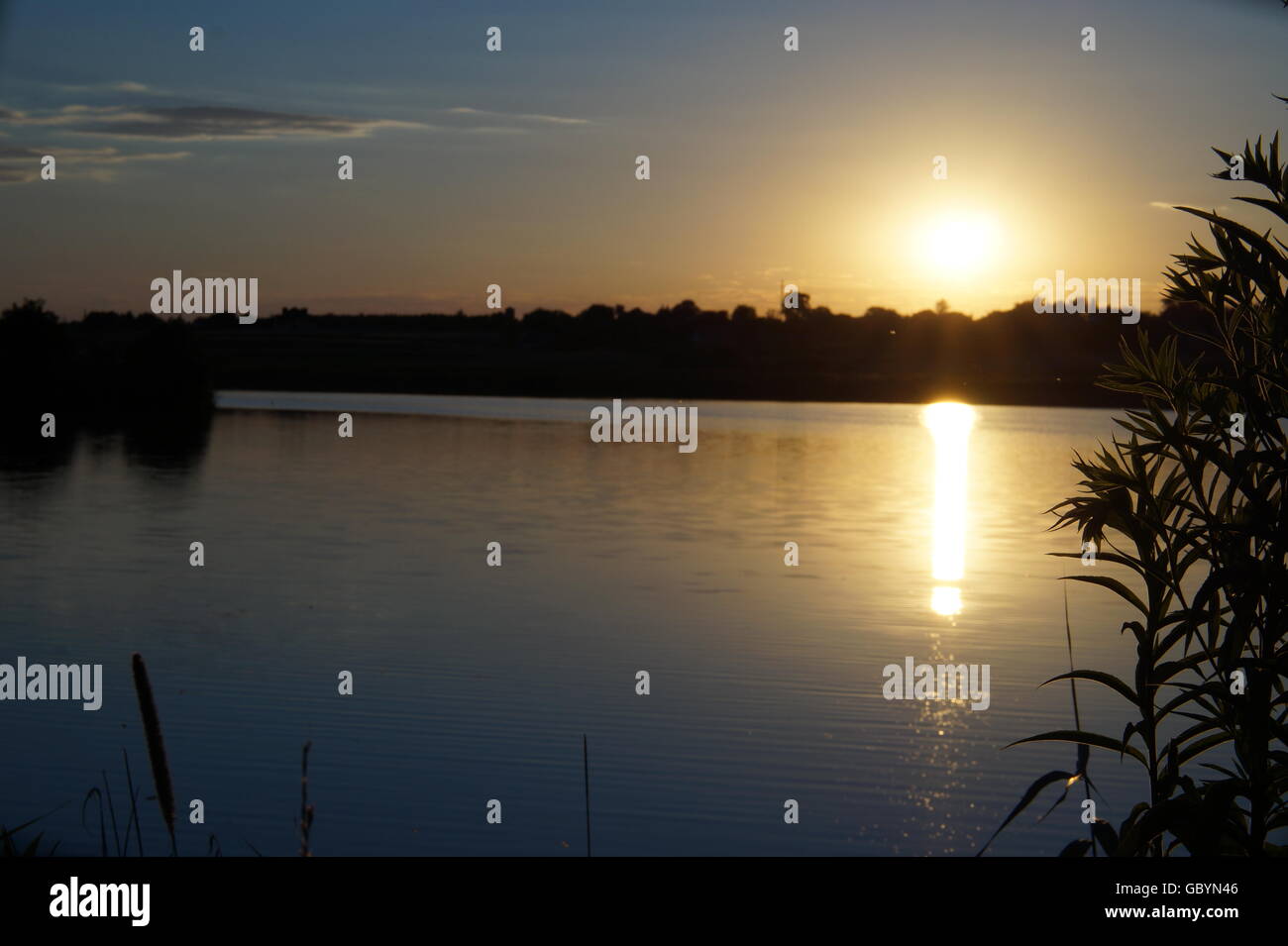 sunset on the river Stock Photo - Alamy