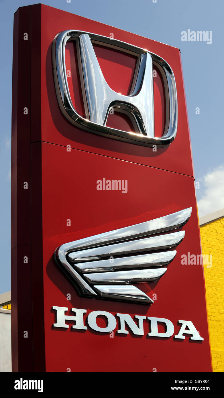 Car forecourt stock. The makers badges on Honda signage at a Honda car ...
