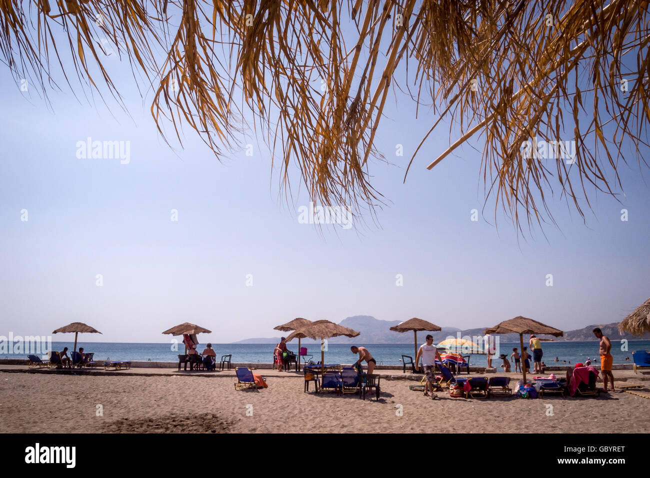 Beach scenes on a Greek island in the summer Stock Photo - Alamy