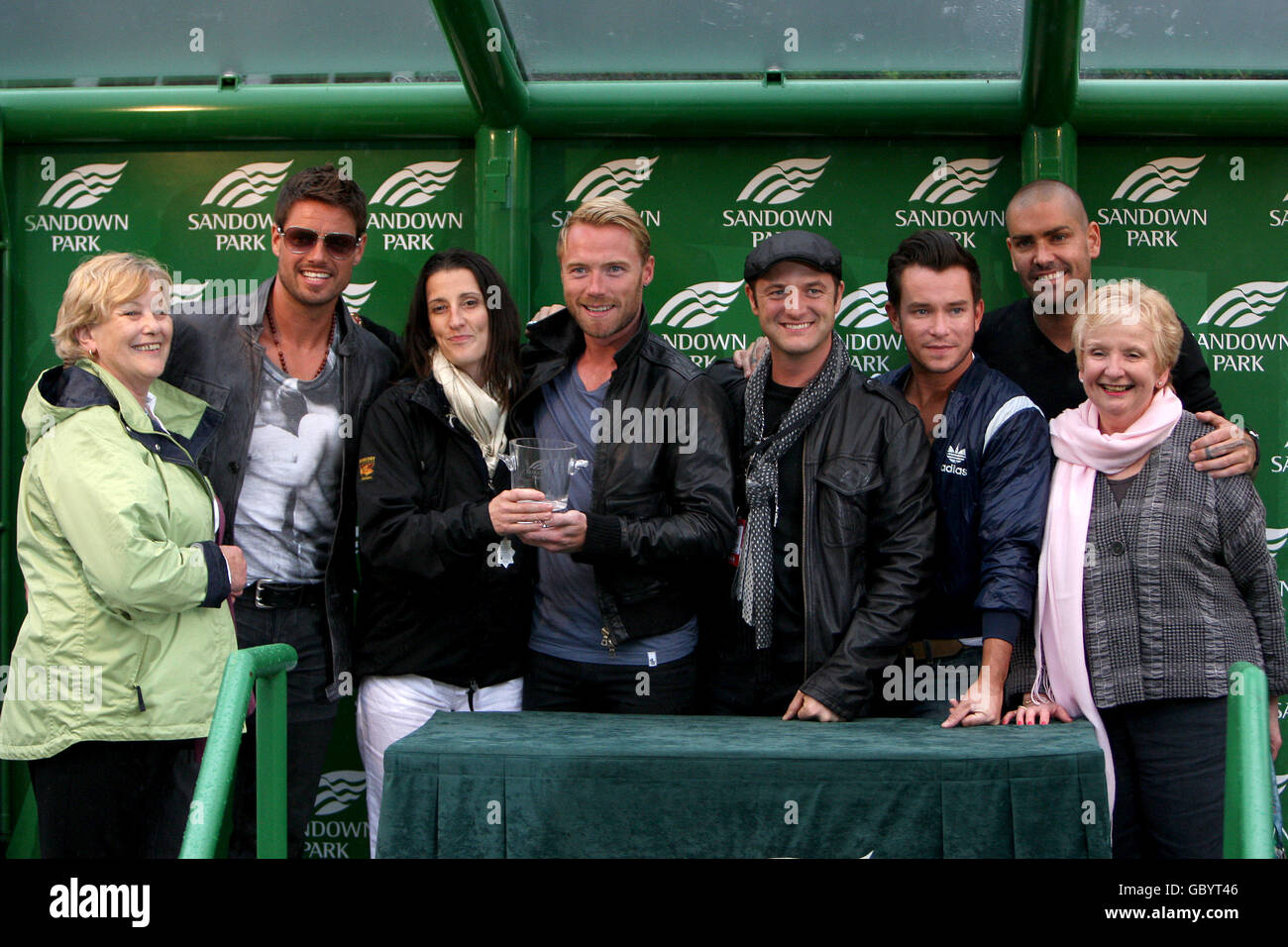Boyzone present an award after a race at sandown park hi-res stock ...