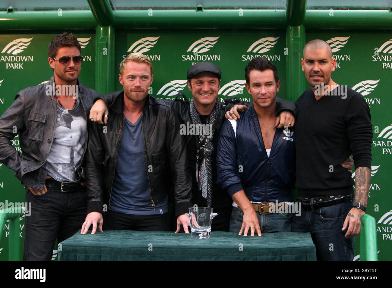 Boyzone prepare to hand over an award after a race at Sandown Park ...