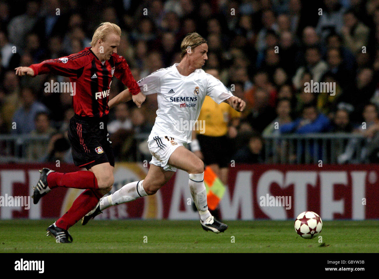 (L-R) Carsten Ramelow, Bayer Leverkusen battles for the ball with Real ...