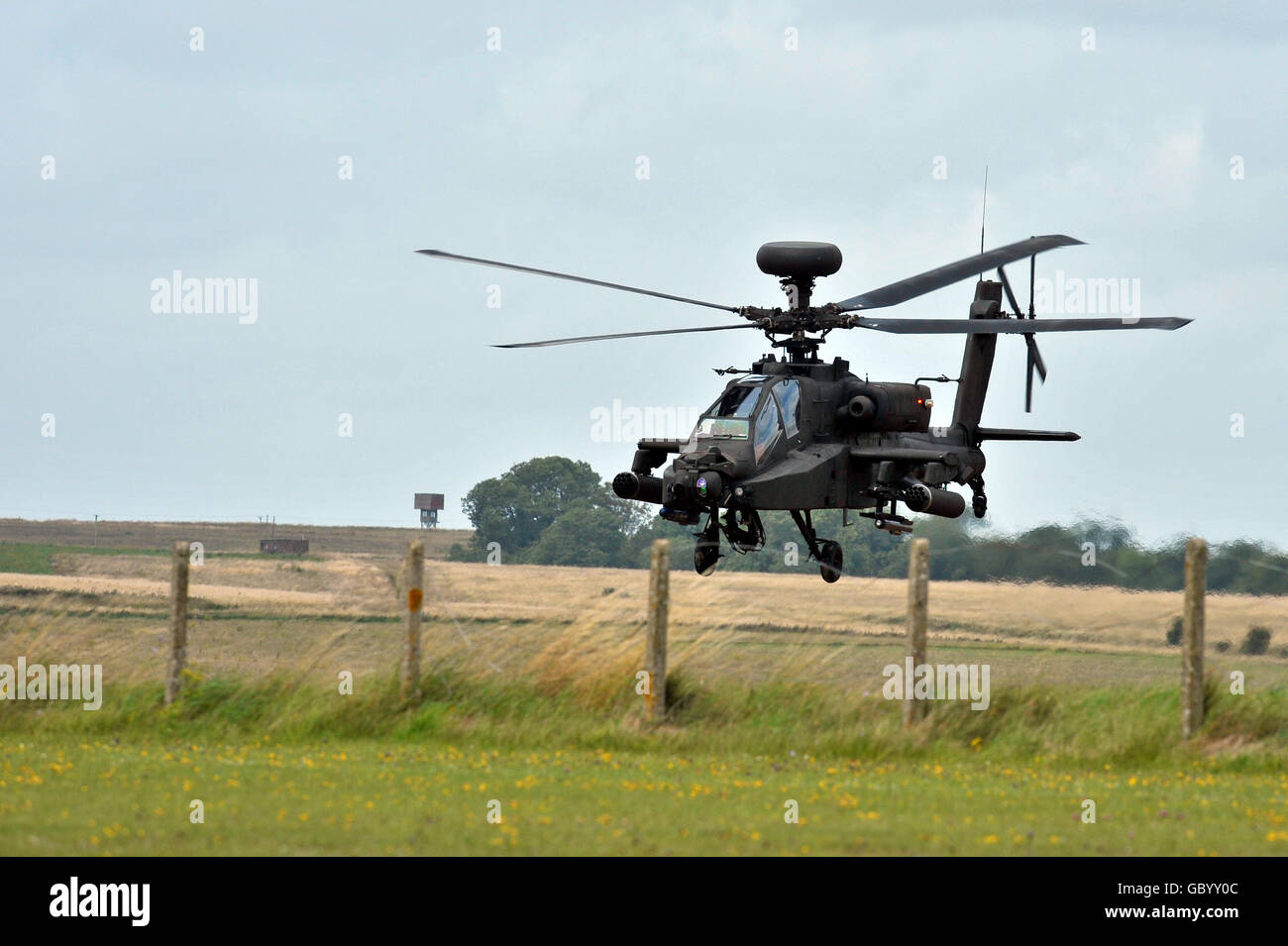 An Army Air Corps Apache Attack Helicopter takes off during 11 Light ...