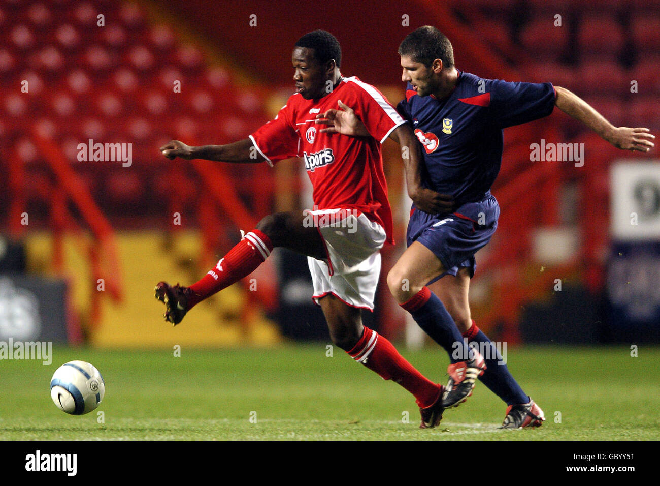 Charlton Athletic's James Walker (l) and Portsmouth's Callum Angus ...