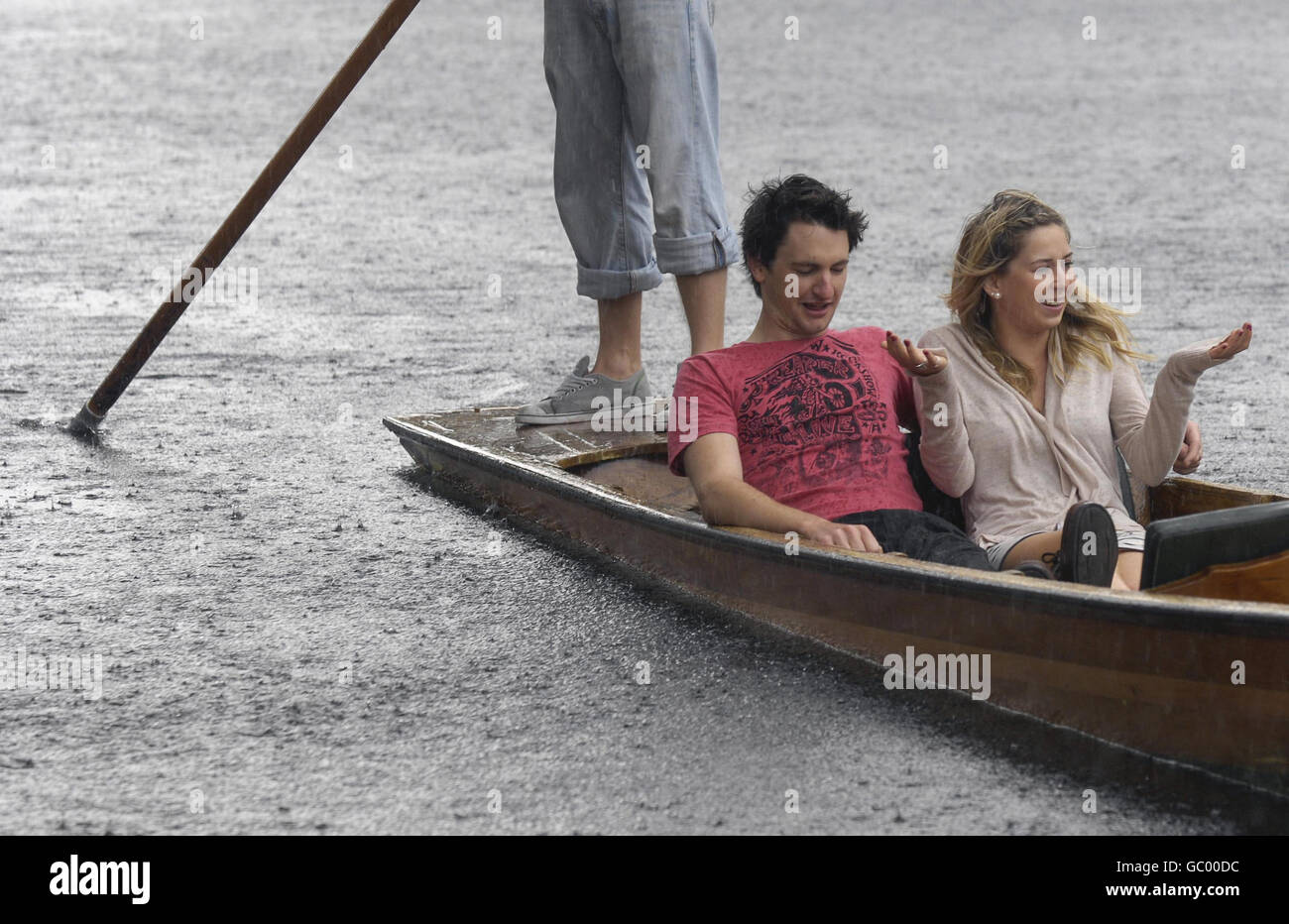 Paul Carruthers and Emily Helliwell are caught out by a rain shower ...