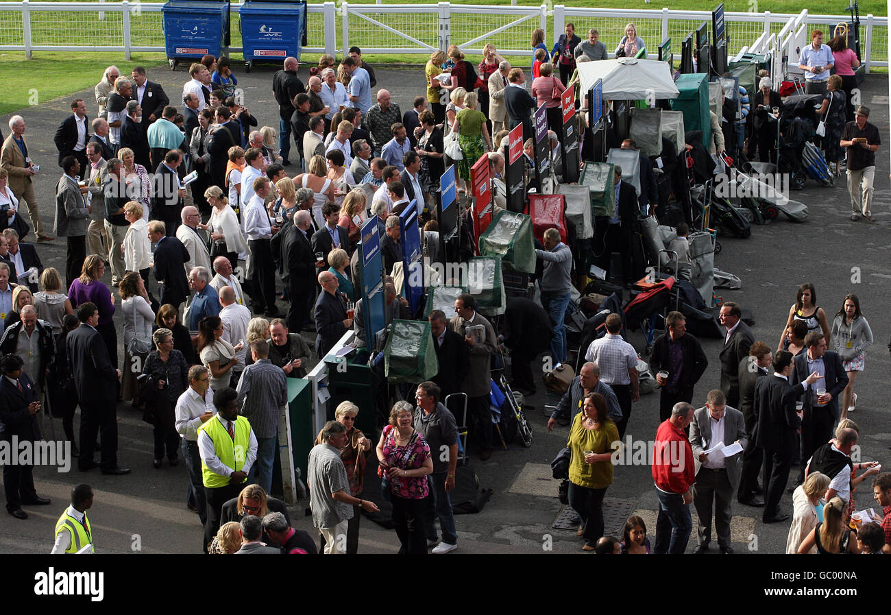 Racegoers put their bets on with the on course bookmakers Stock Photo ...
