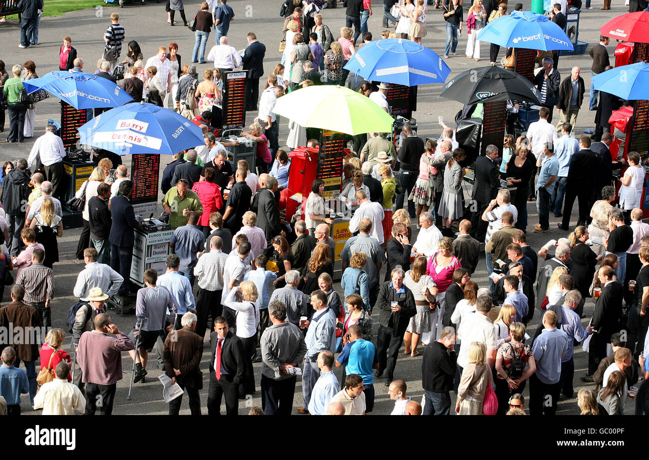 Racegoers put their bets on with the on course bookmakers Stock Photo ...