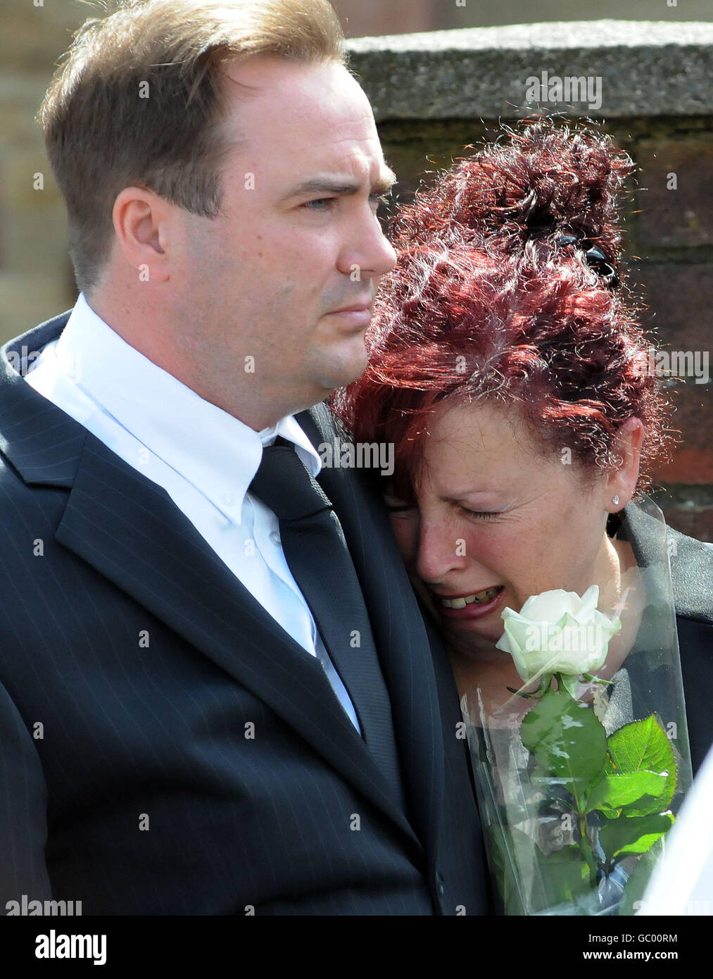 Diane Whiteside (right) is comforted at the funeral of her son Trooper ...