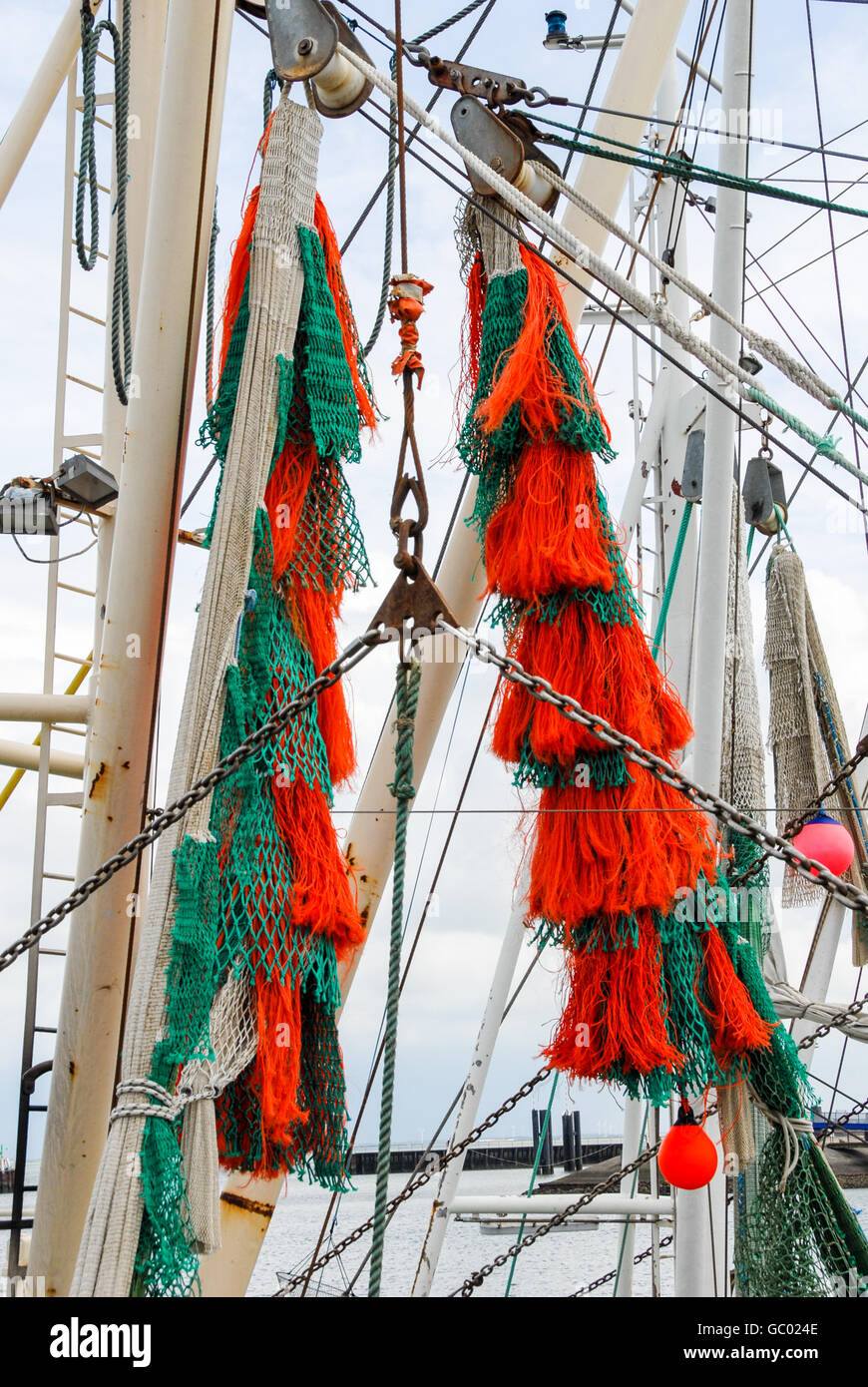 Fishing utensils at a mast of a fishing trawler Stock Photo - Alamy