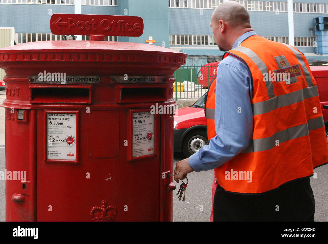 A generic view of postal worker emptying a post box central London ...