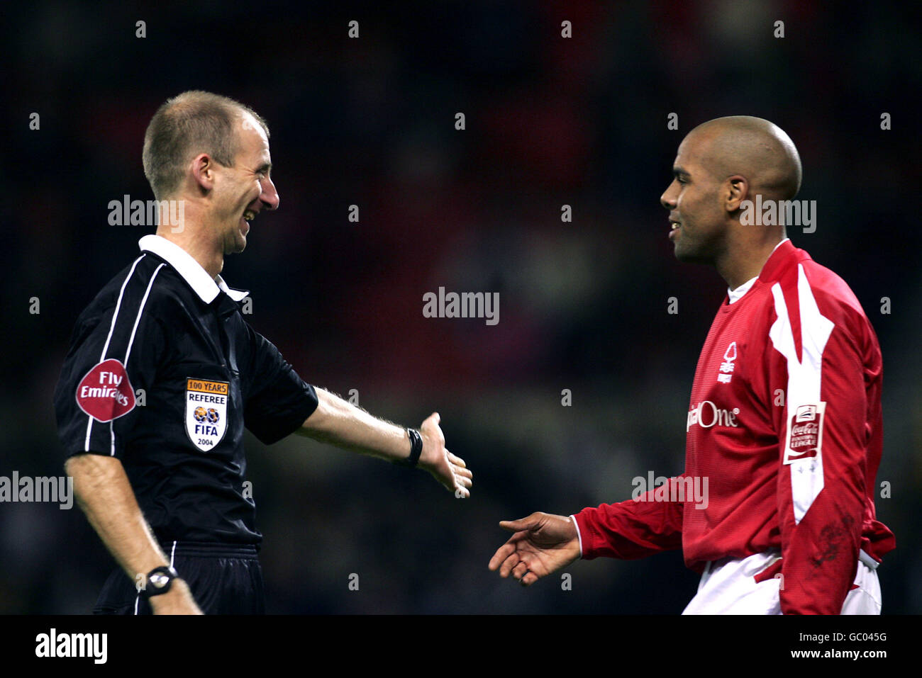 Referee Mike Riley (l) explains a decision to Nottingham Forest's ...