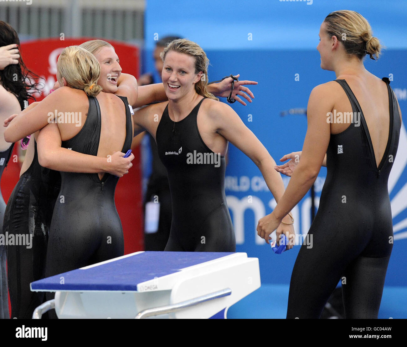 British swimmer Rebecca Adlington is hugged by Caitlin McClatchey, with ...