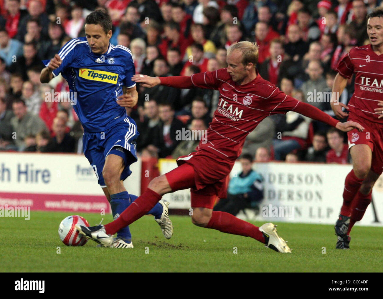 Aberdeen's Stuart Duff holds off Sigma Olomouc Tomas Janotka during ...
