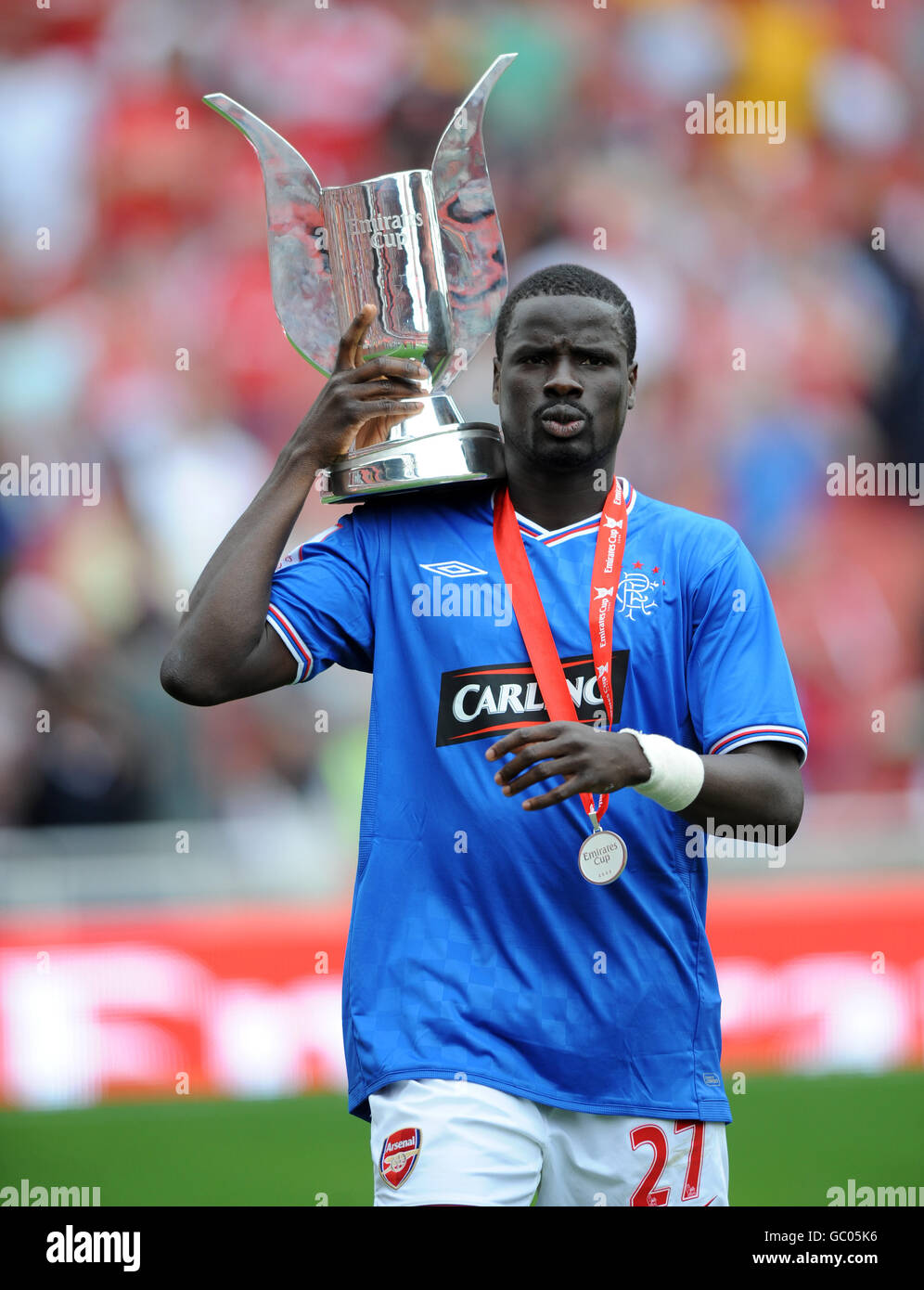 Arsenal's Emmanuel Eboue celebrates with the Emirates Cup Stock Photo ...