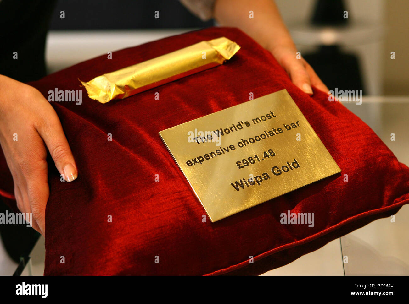 Gold bar in wrapper hi-res stock photography and images - Alamy