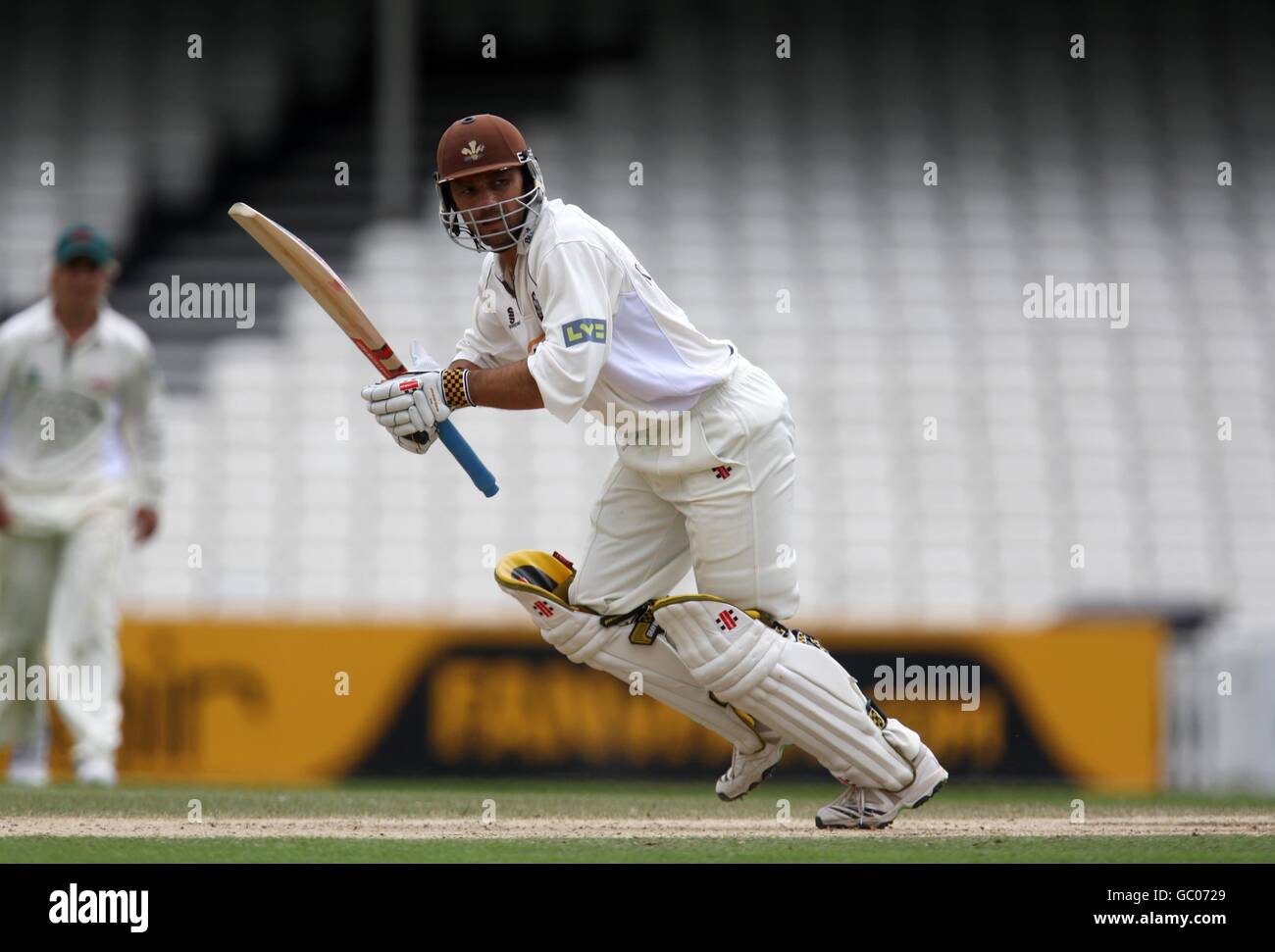Surrey's Mark Ramprakash hits the ball for another boundary during his ...