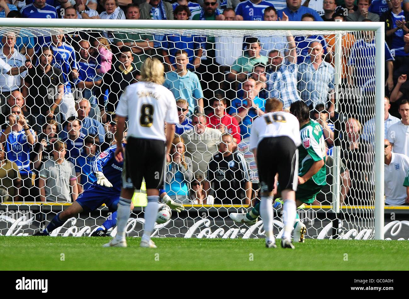 Peterborough United's George Boyd (right) scores his sides first goal ...