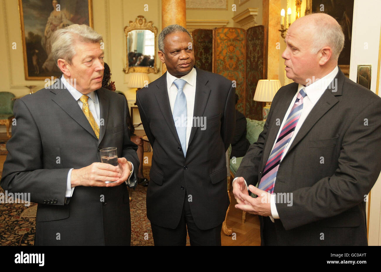 Home Secretary Alan Johnson (left) talks with Barry Mizen (right) as ...