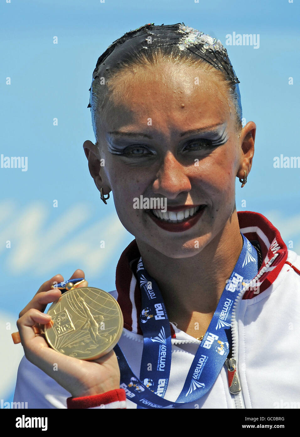 Gold medallist Russia's Natalia Ishchenko smiles as she poses with her medal following the solo ...