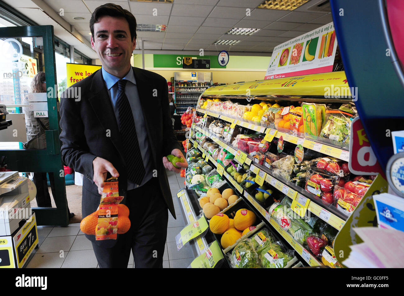 Health Secretary Andy Burnham picks up some fruit during a visit to a ...